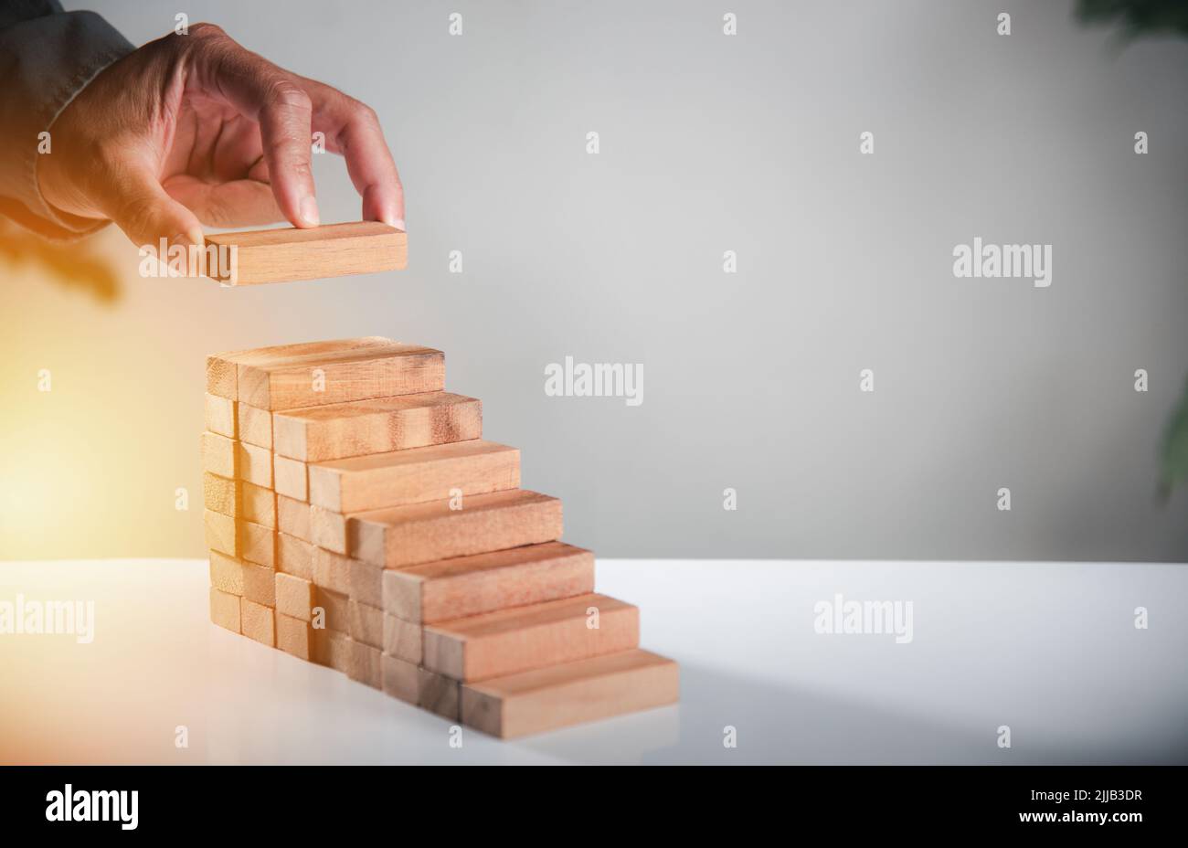 Business hand arranging put wooden block stacking step stair growth ...