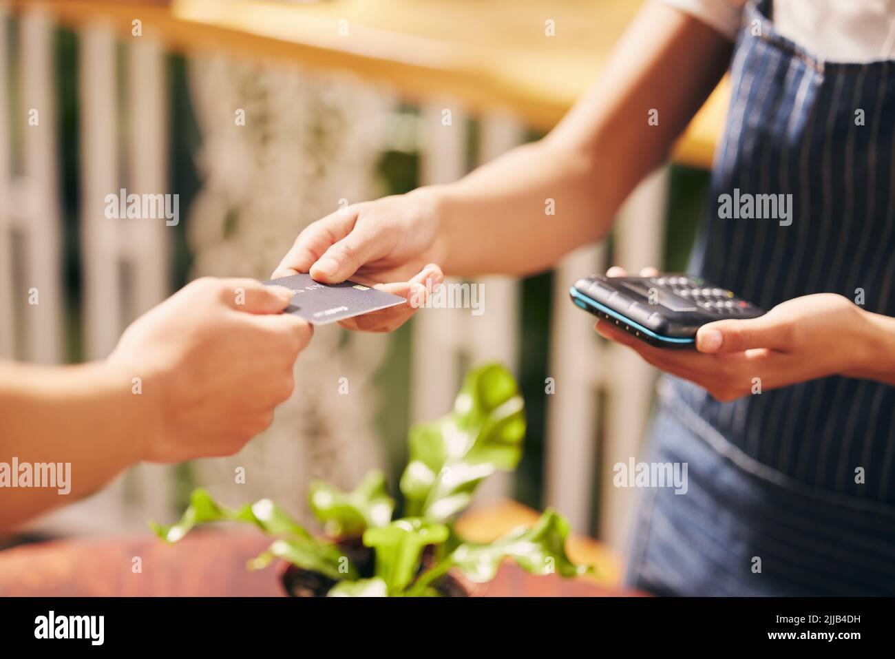 No need to carry a wallet. a customer using a card and an NFC scanner ...