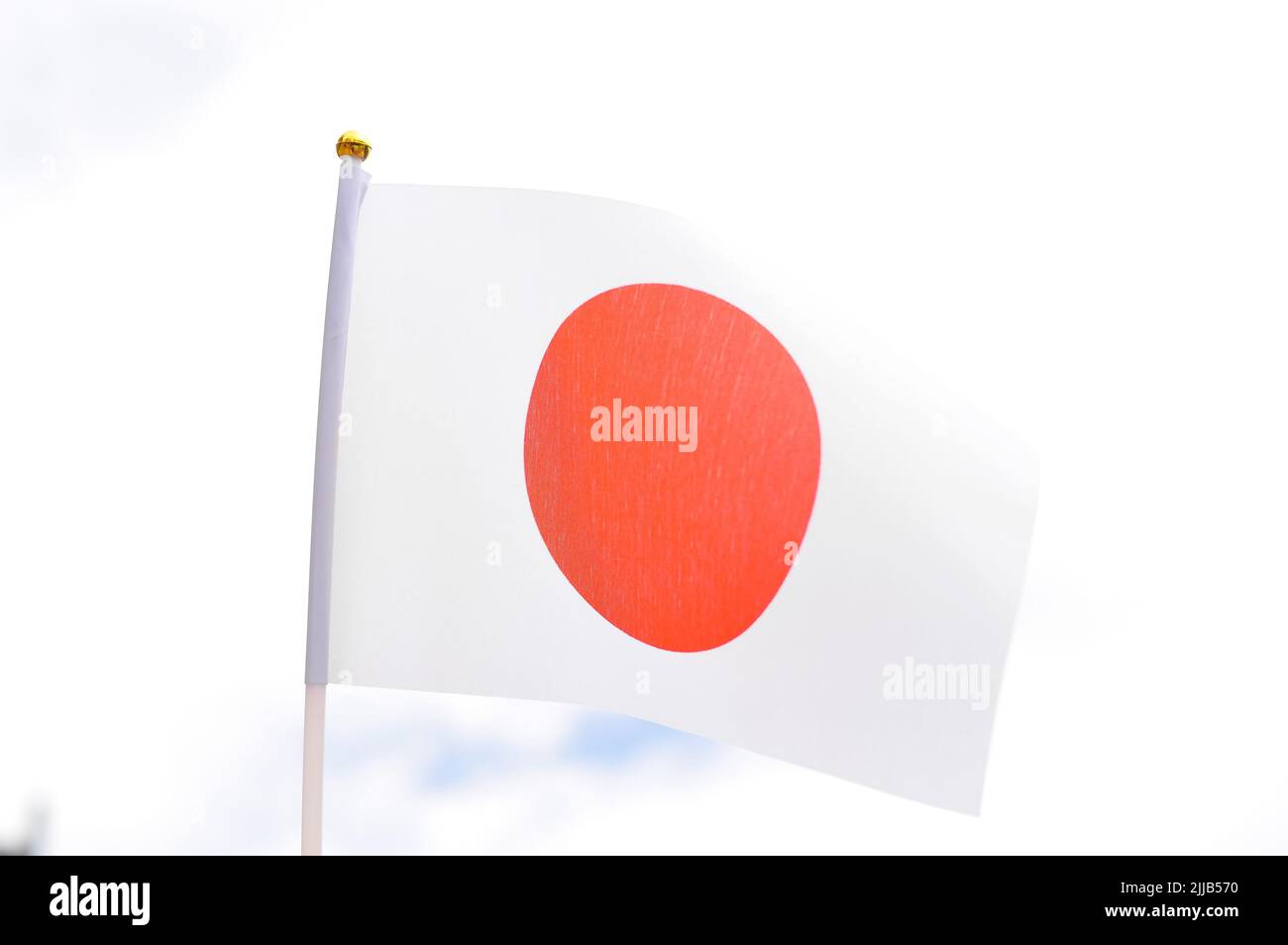 Close up of national flag of Japan round red circle on white background ...