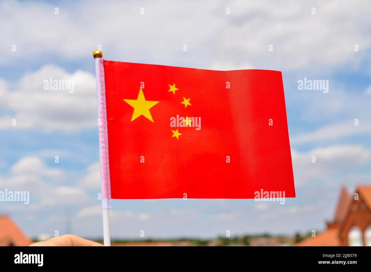 national flag of China red color and yellow stars close up Stock Photo ...