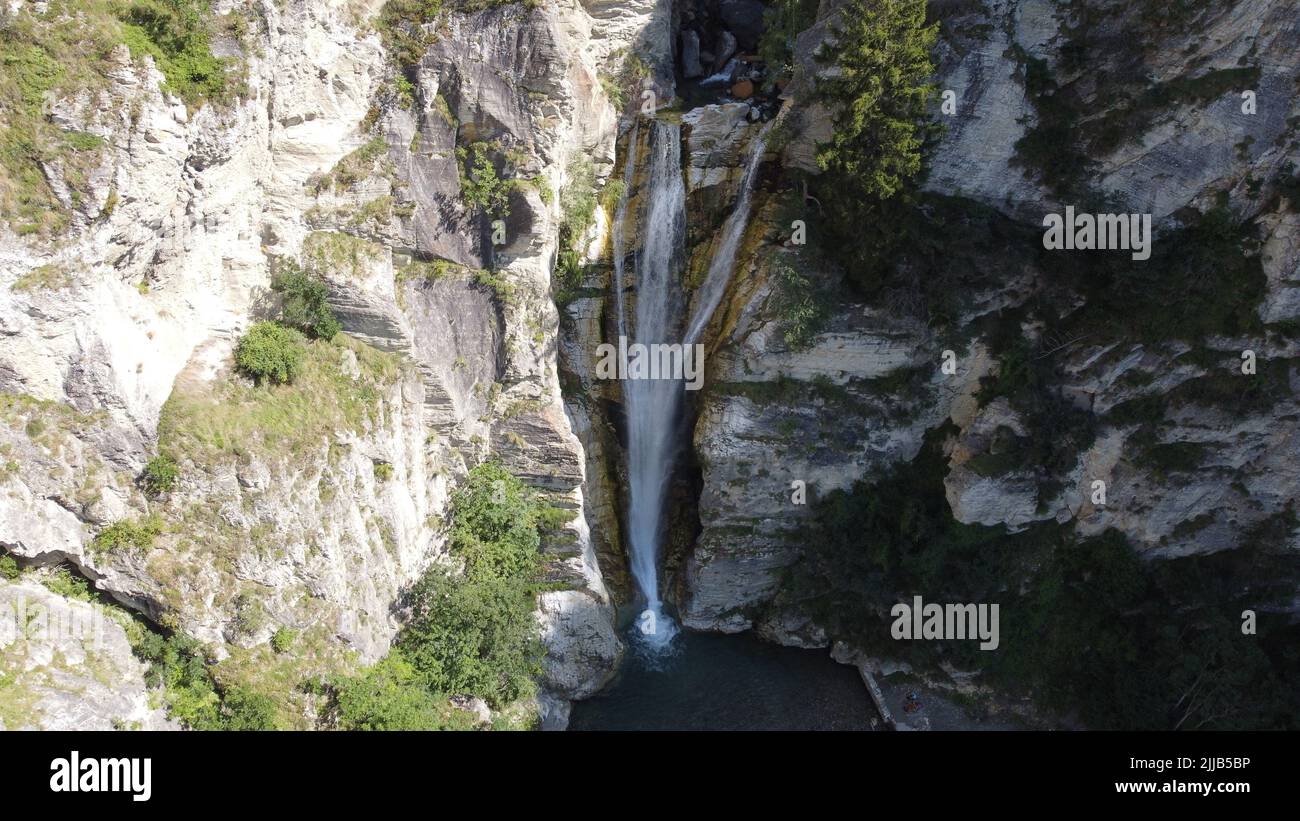 A high waterfalls with big rocks Stock Photo - Alamy