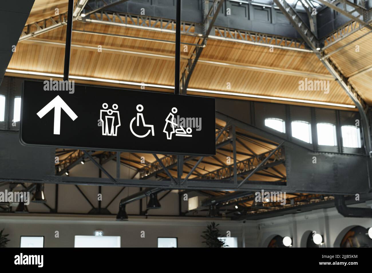 Modern public toilet sign on the wall Stock Photo - Alamy