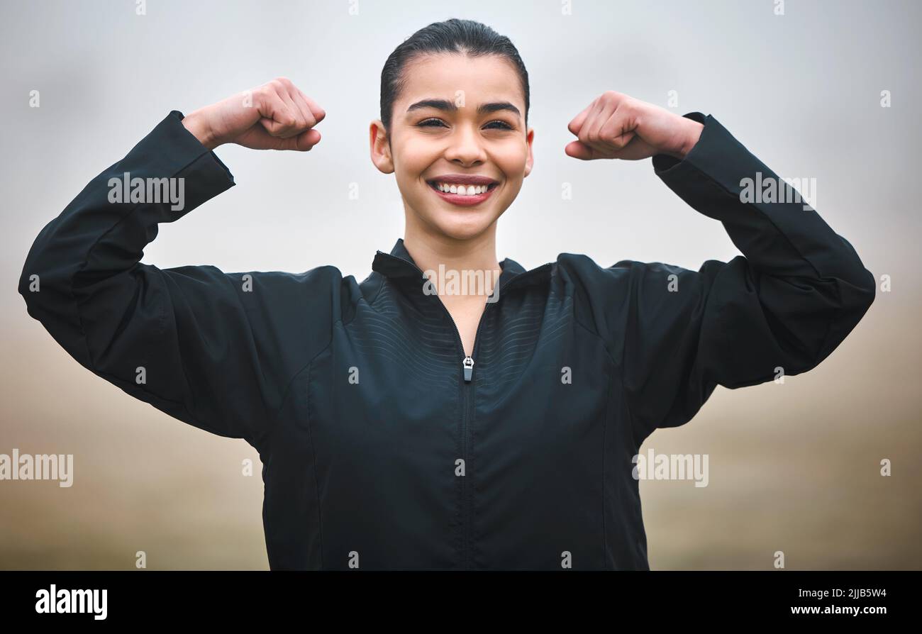 Subtle flex. Cropped portrait of an attractive young female athlete ...