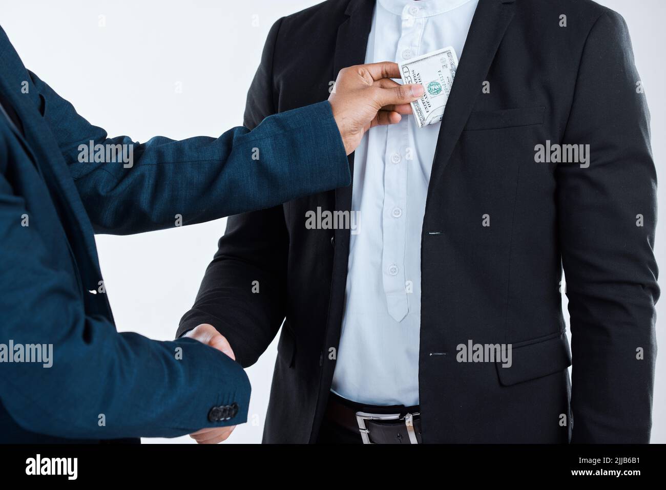 Capitalize on what comes. money being placed in a businessmans pocket ...