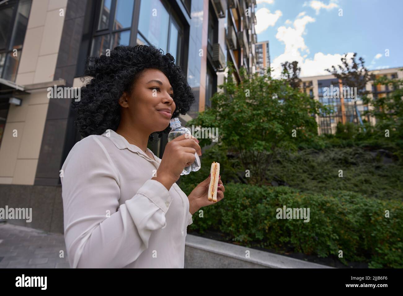 Busy female eating snacks hi-res stock photography and images - Alamy