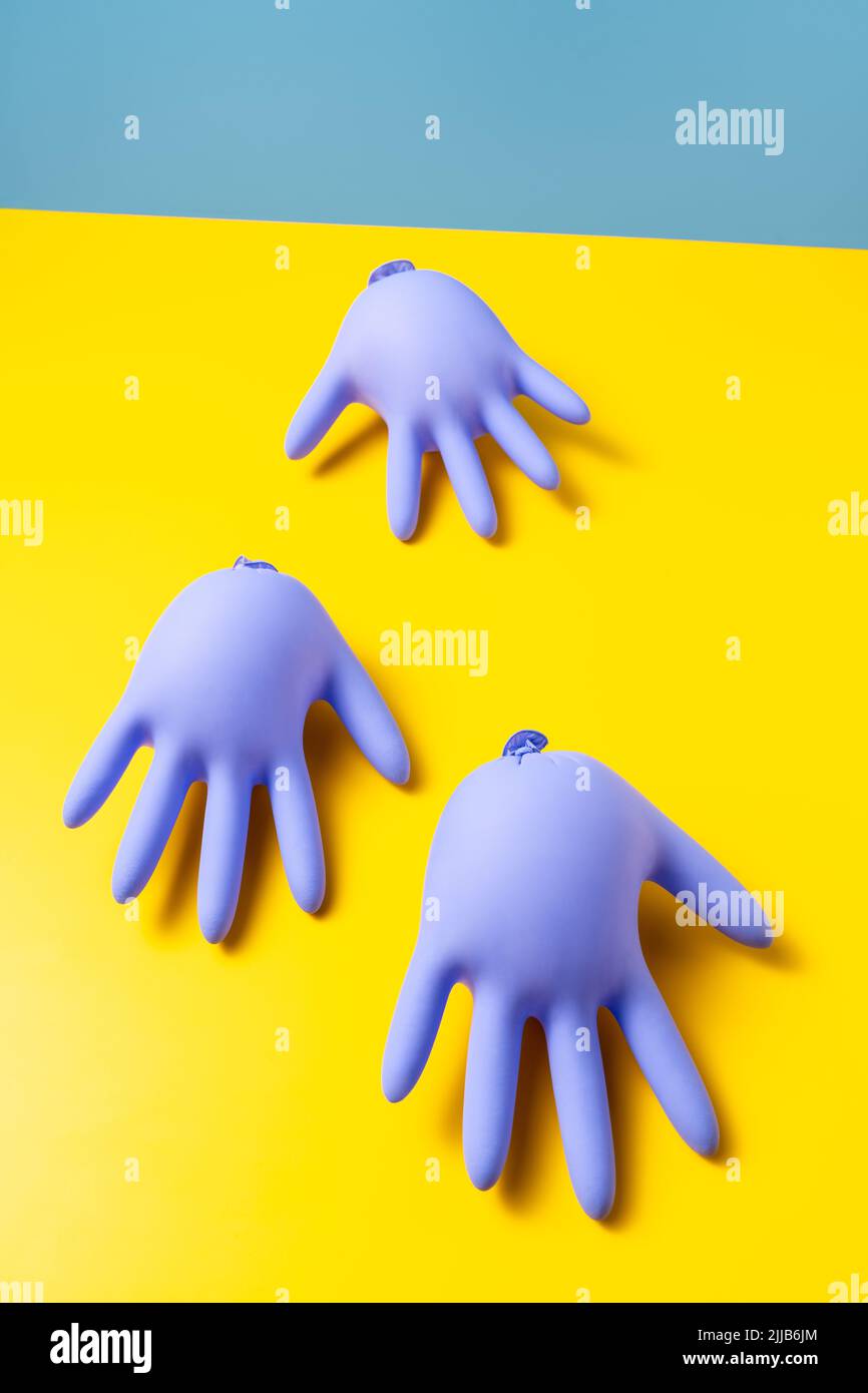 Yellow inflated rubber glove hi-res stock photography and images - Alamy