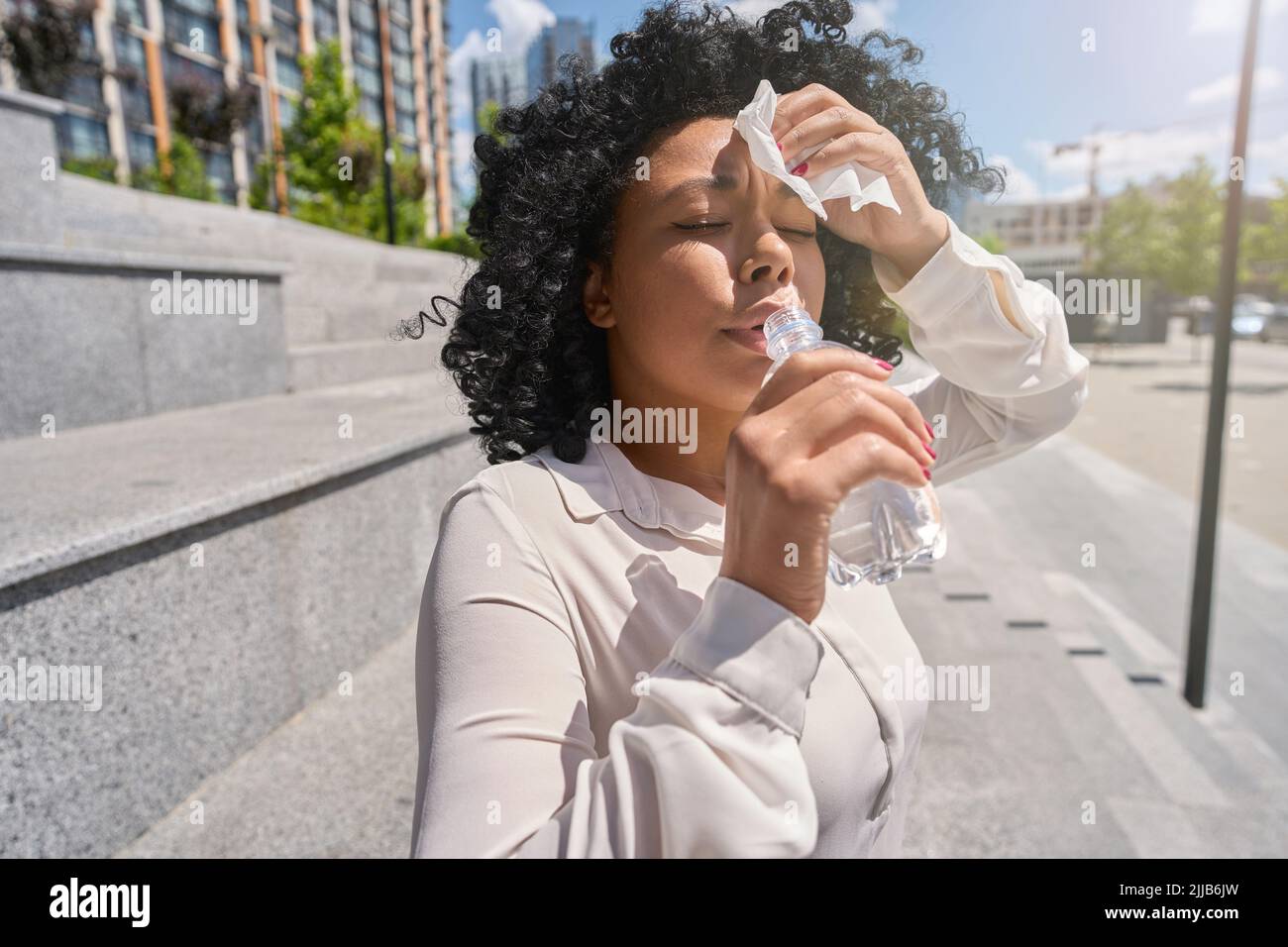 Woman overheated in the sun and dehydrated Stock Photo - Alamy