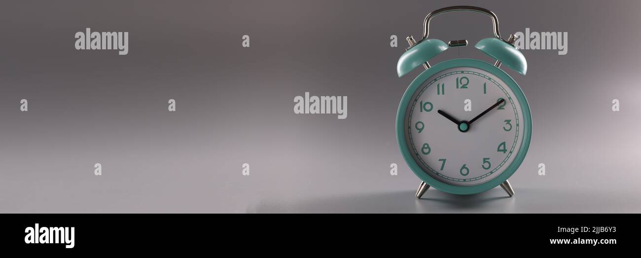 Turquoise alarm clock at ten o'clock on gray background Stock Photo - Alamy