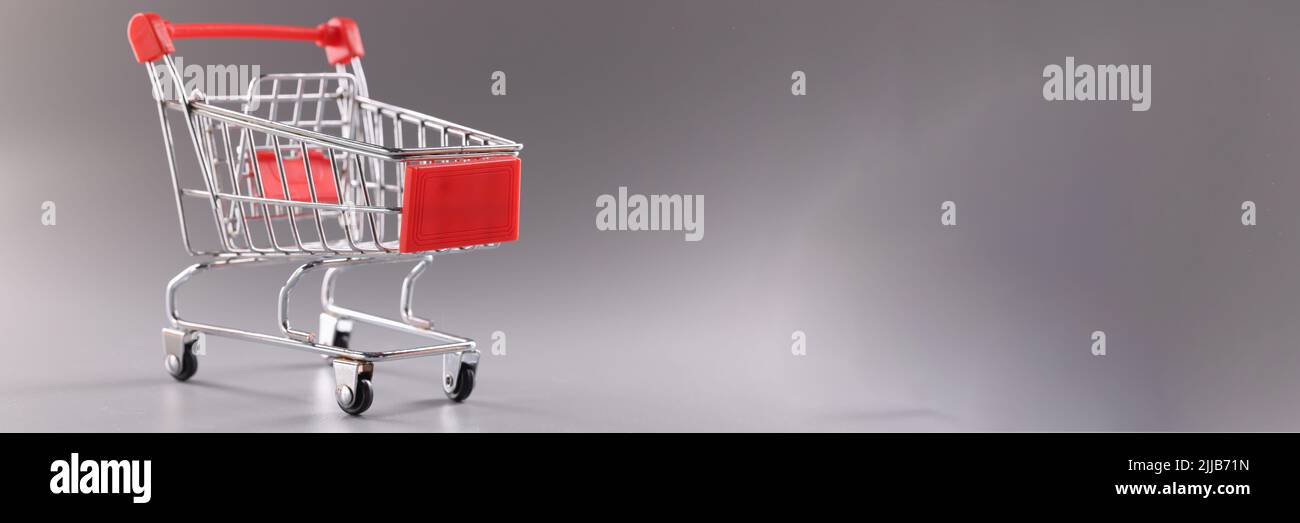 Trolley with chrome handle on gray background Stock Photo - Alamy