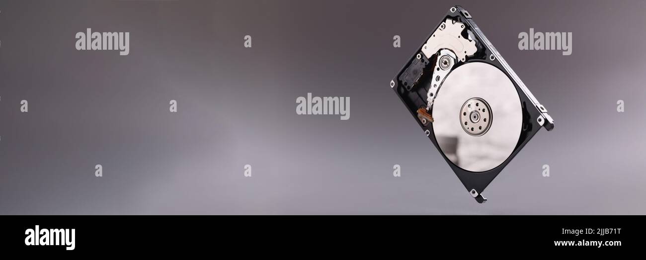 Hard disk drive HDD with open top cover on gray background Stock Photo ...