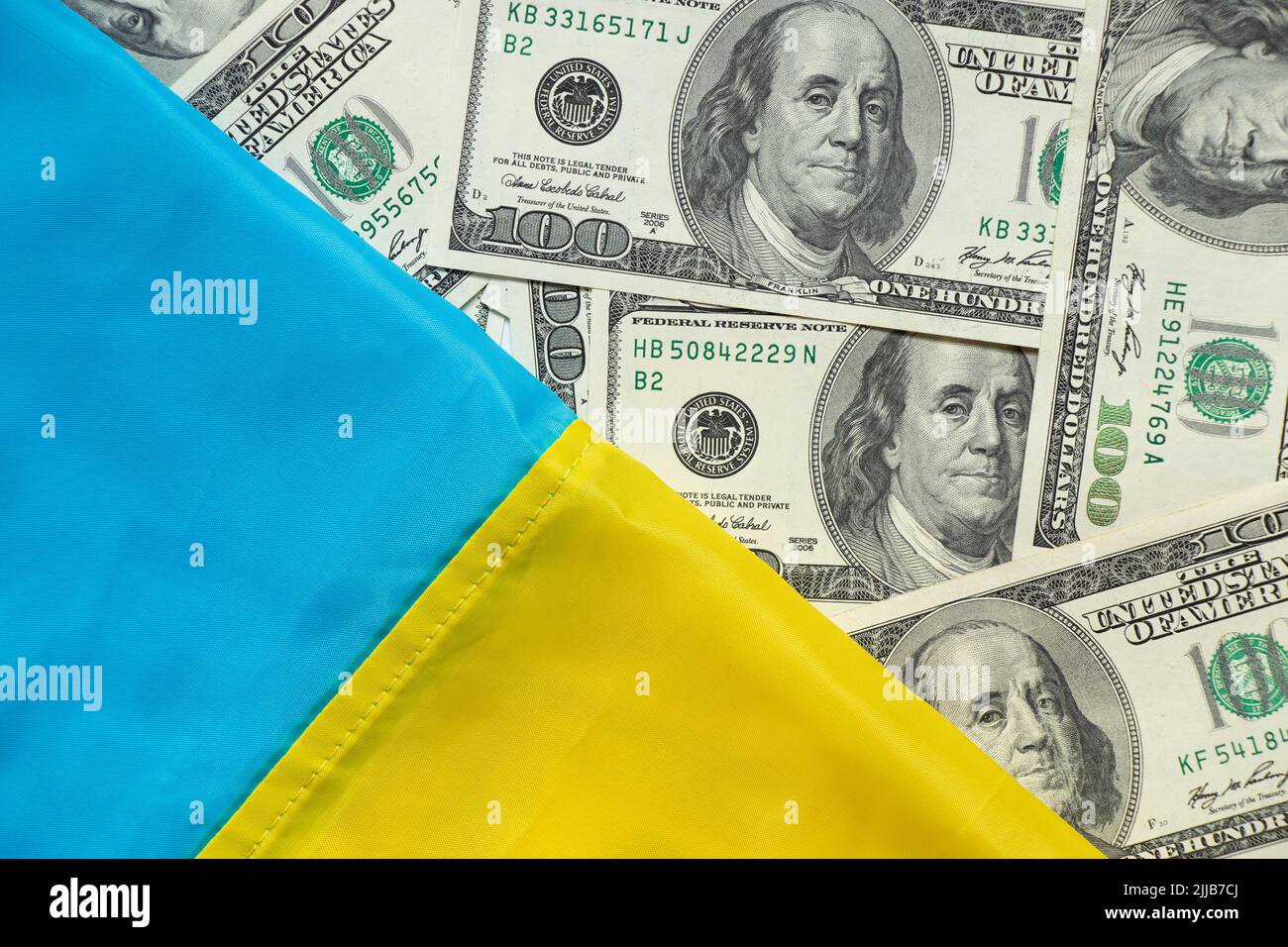 One hundred dollars and the flag of Ukraine, help and financial support ...