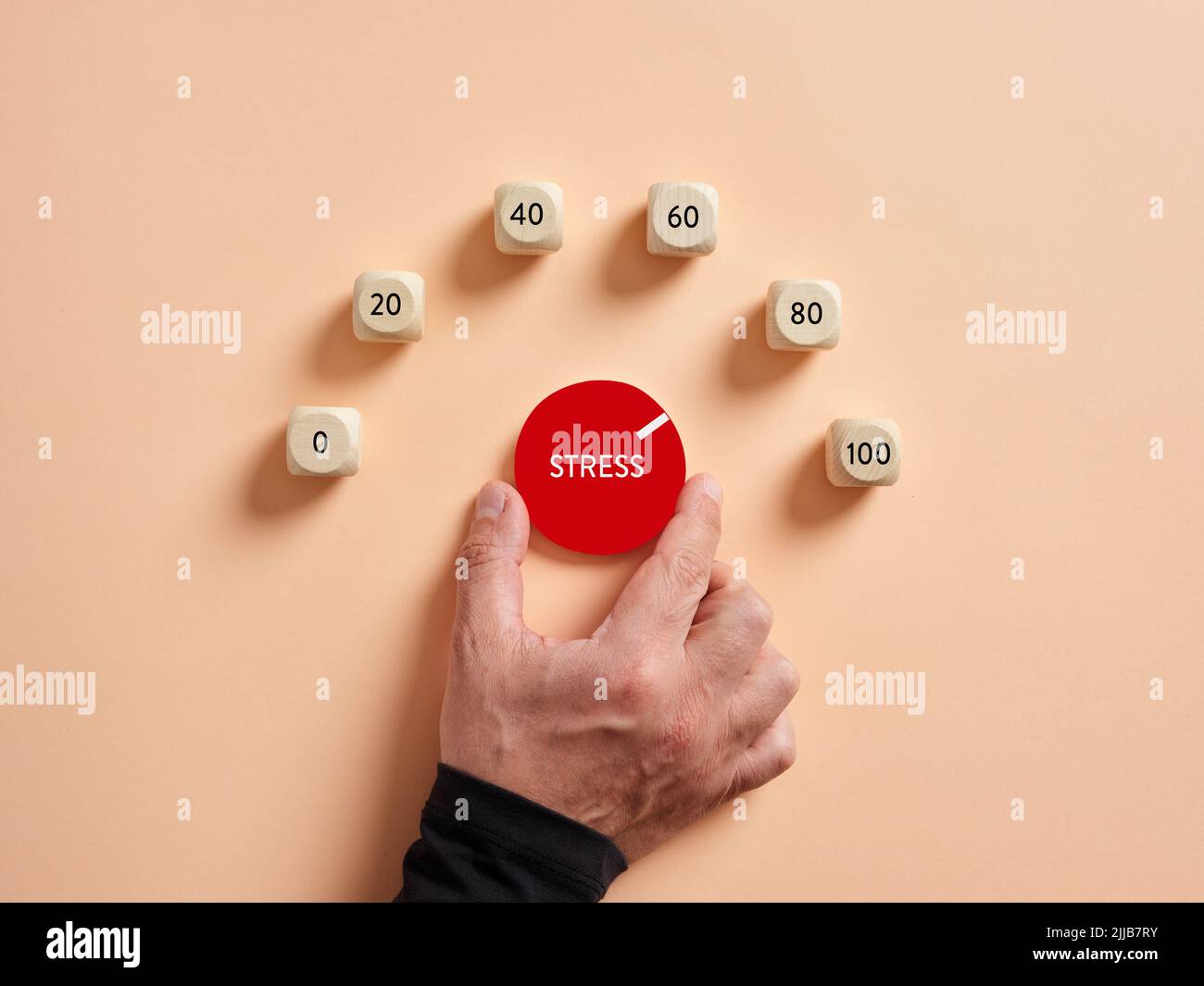 Hand turning stress level meter indicating high level of stress Stock ...