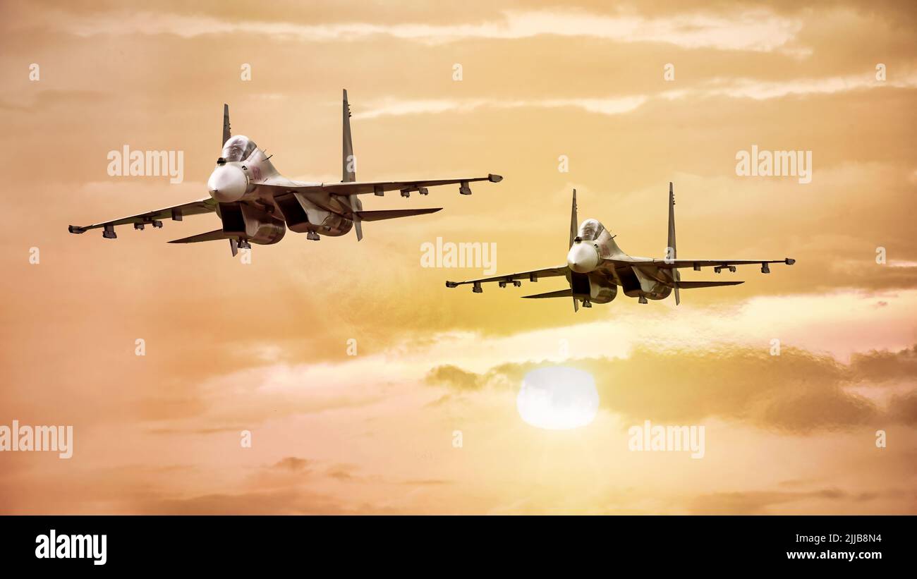 squadron of 2 sukhoi su30 taking off in dawn Stock Photo - Alamy