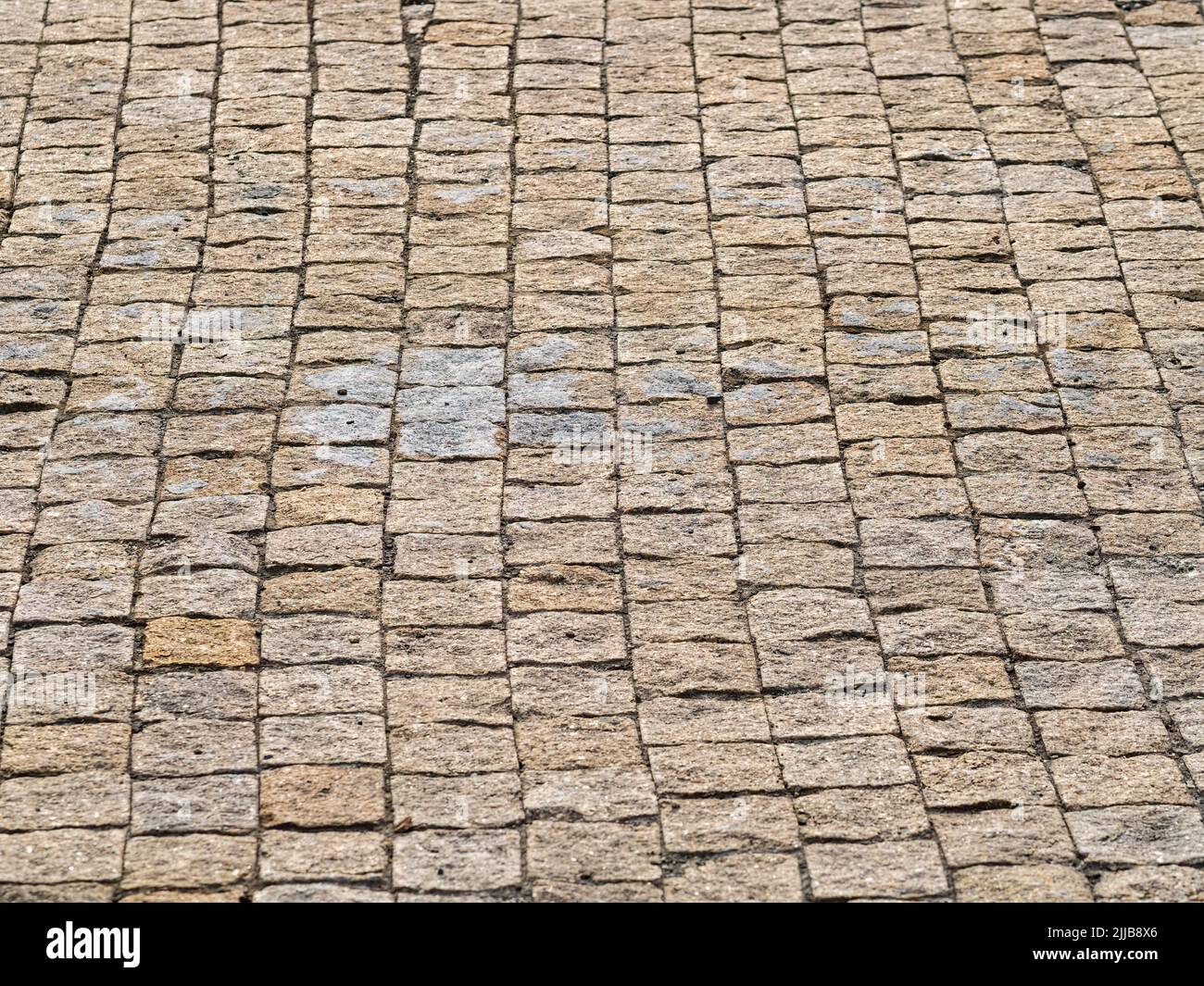 Stone pavement in the rays of the setting sun. Backround of Block ...