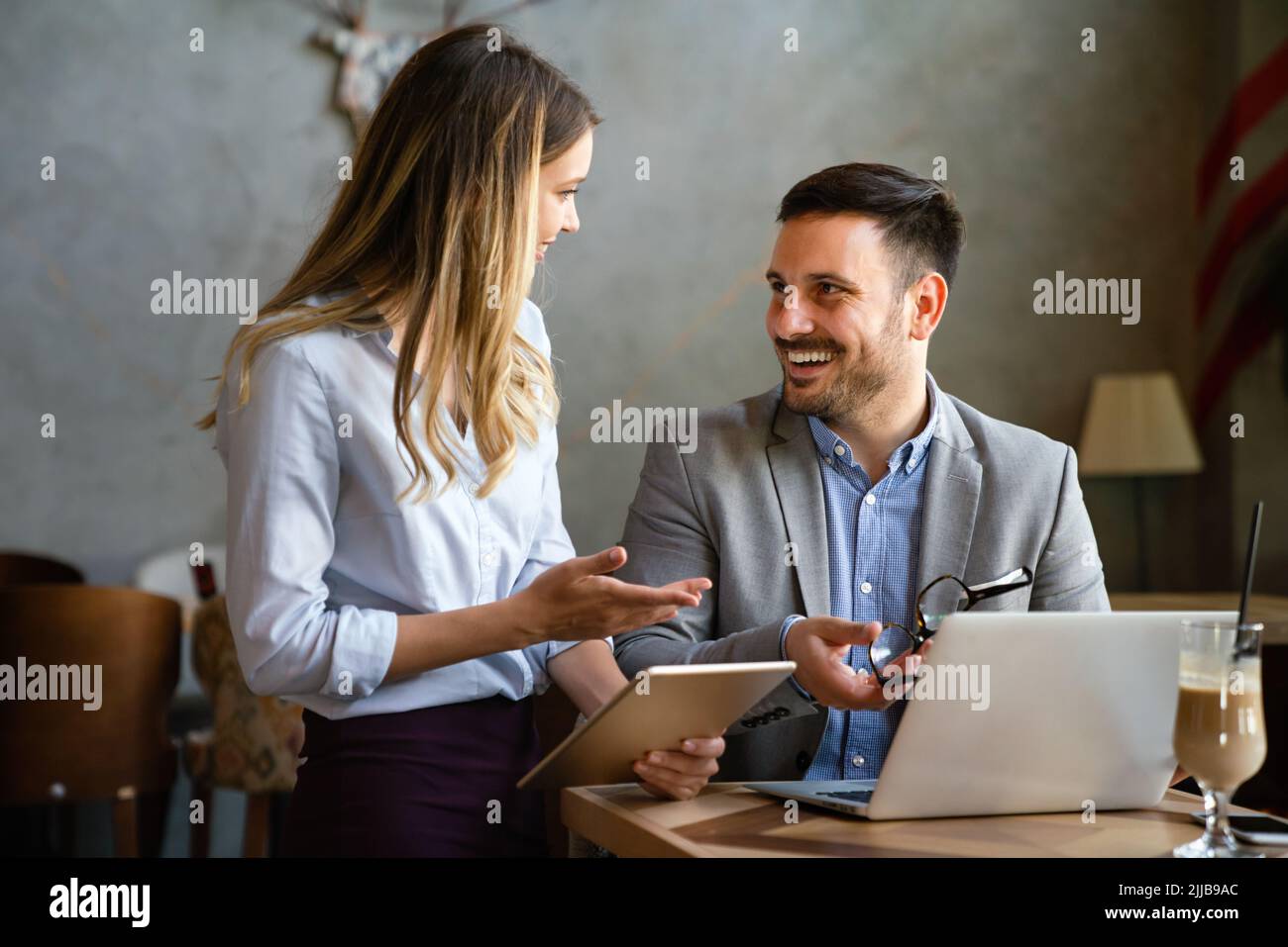 Business people having fun and chatting at workplace office Stock Photo ...