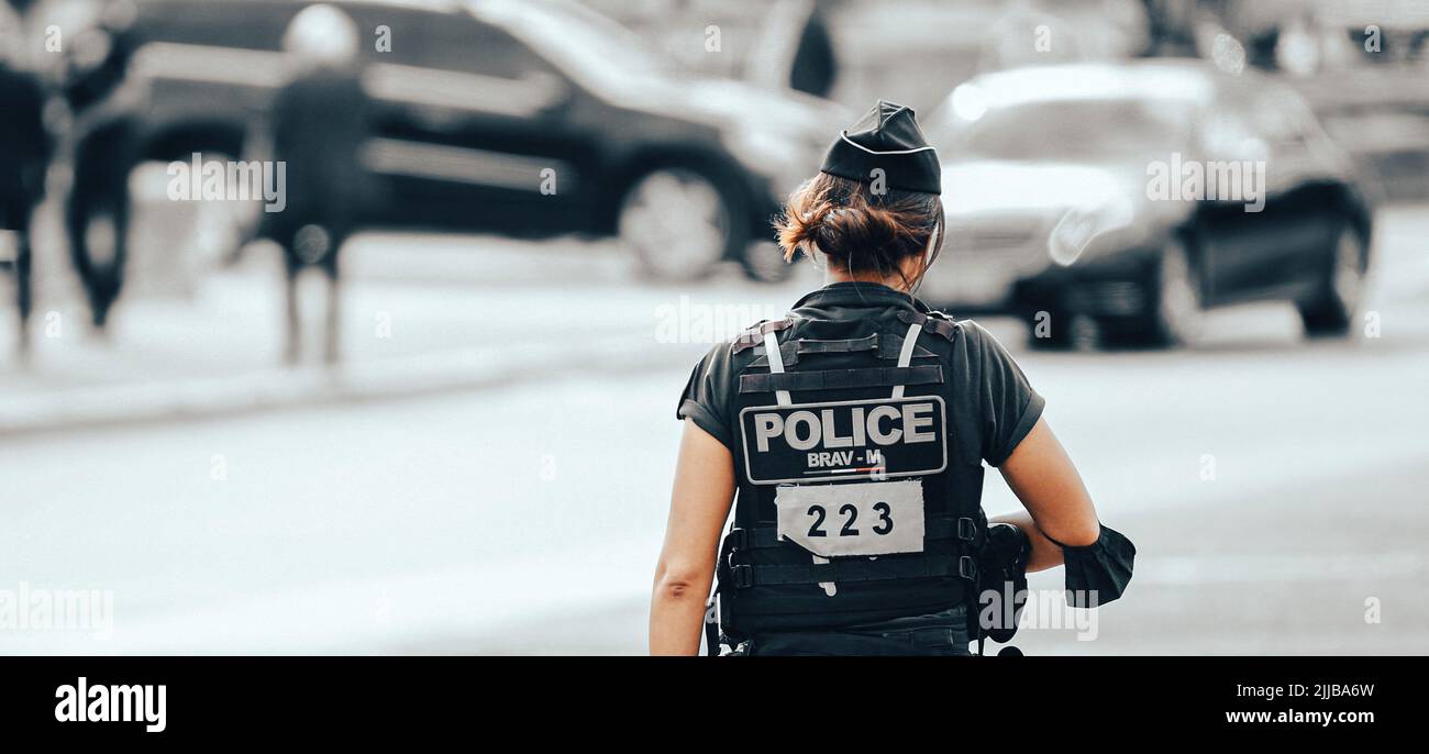 A policewoman officer (woman) on duty ensures the safety of citizens in ...