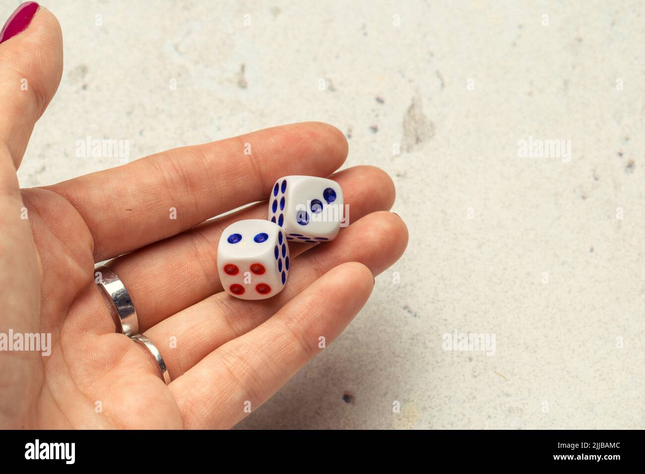 hand with a pair of dice Stock Photo - Alamy