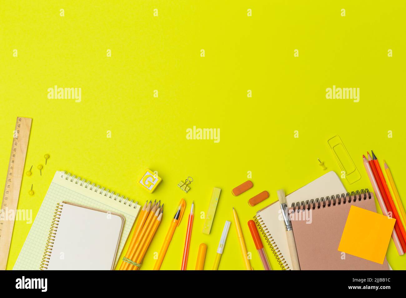 school supplies at colorful paper background Stock Photo - Alamy