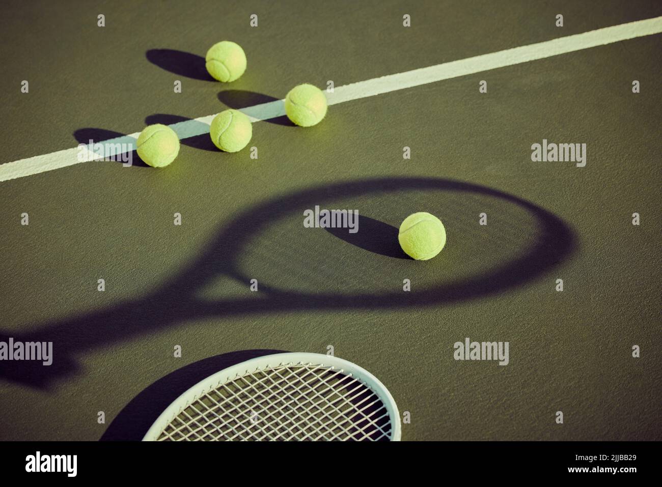 Tennis racket and balls lying on court hi-res stock photography and ...