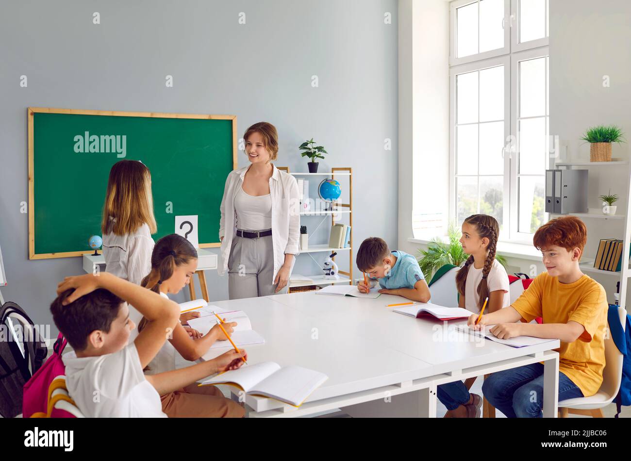 Students writing in notebooks hi-res stock photography and images - Alamy