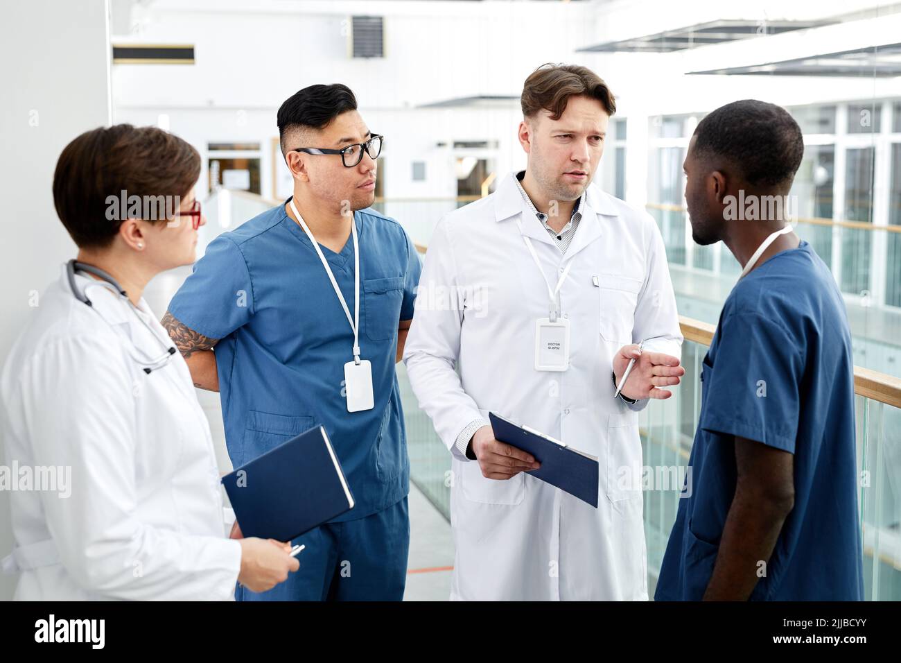 Diverse male doctors talking hi-res stock photography and images - Alamy