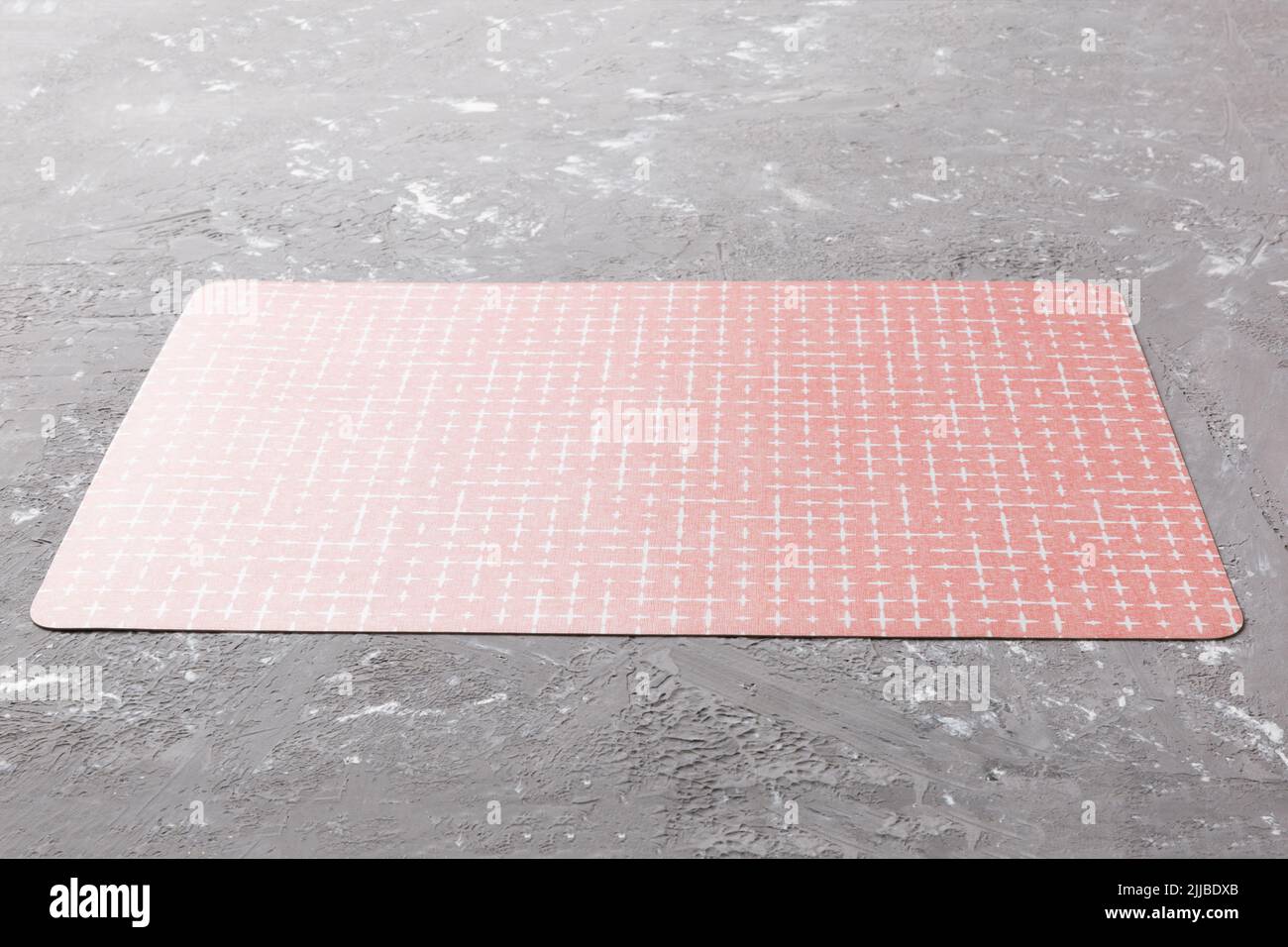 Perspective view of red tablecloth for food on cement background. Empty ...