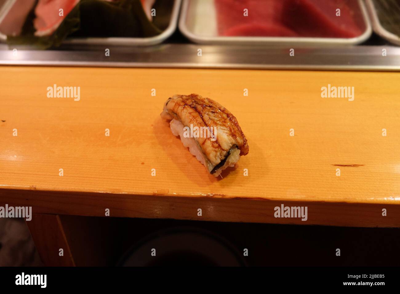 Close up Barbecue Unagi (Eel) Sushi on wooden table bar Stock Photo - Alamy