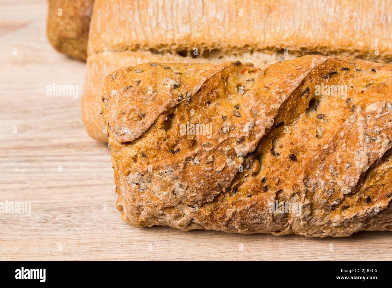Homemade natural breads. Different kinds of fresh bread as background ...