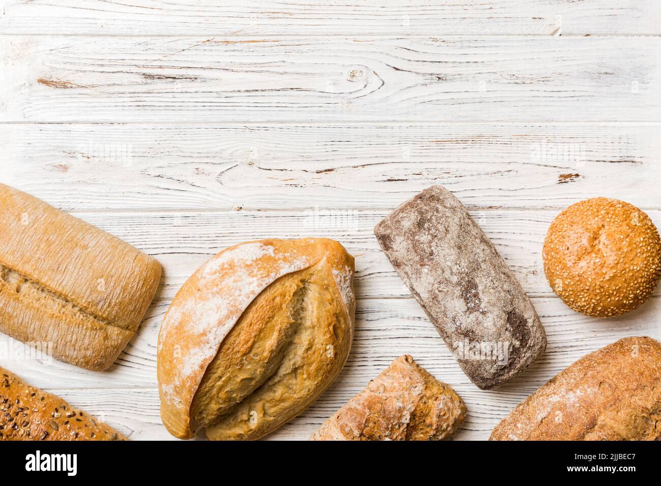 Homemade natural breads. Different kinds of fresh bread as background ...