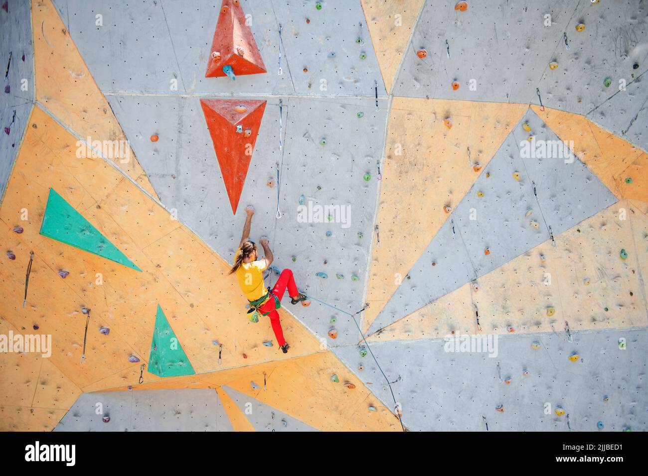 Young and fit man exercise free mountain climbing on outdoor practice ...