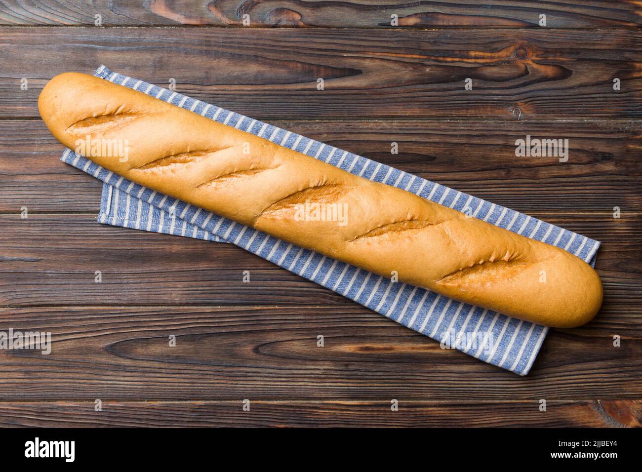 fresh crunchy french baguette on colored table. Top view Bakery ...