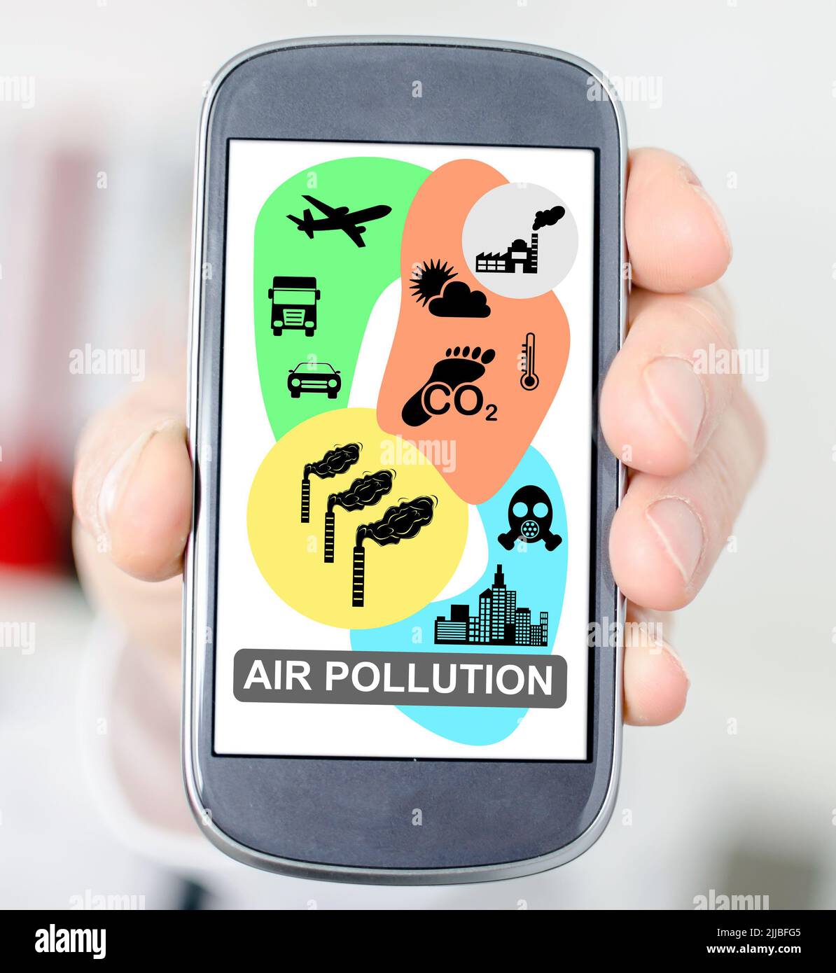 Hand holding a smartphone with air pollution concept Stock Photo - Alamy