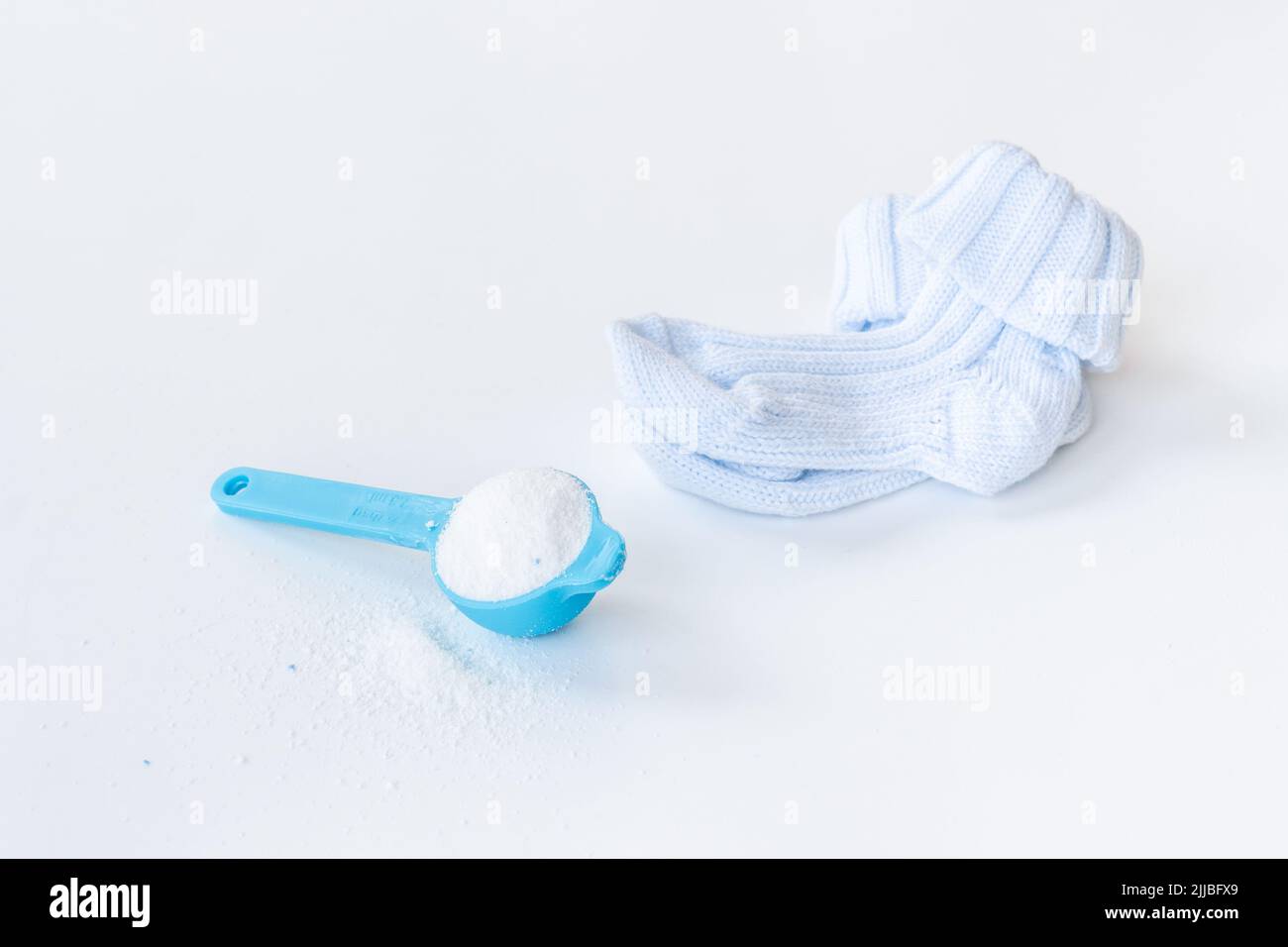 White washing powder with measuring cup. Laundry day concept Stock ...