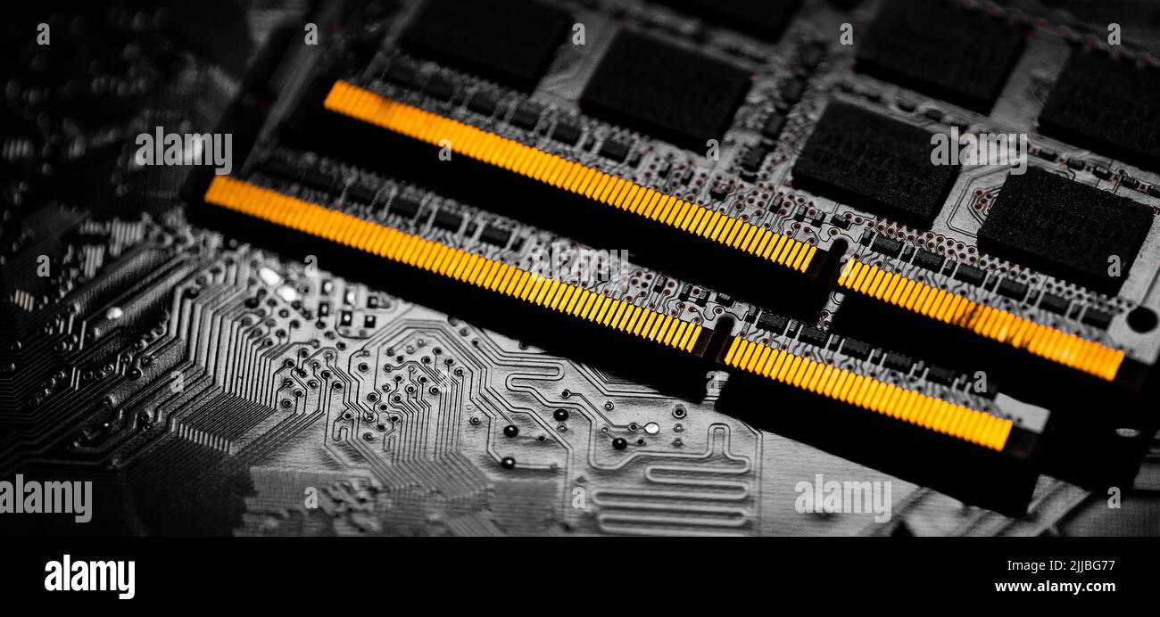 Macro Close up of computer RAM chip and motherboard on dark background ...