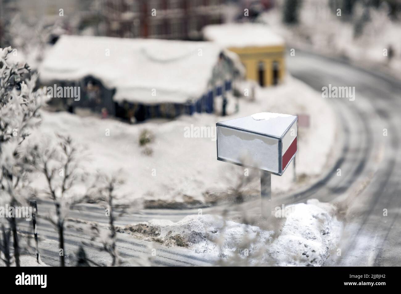 Layout of the city and small figures. View of the snow-covered turn of ...