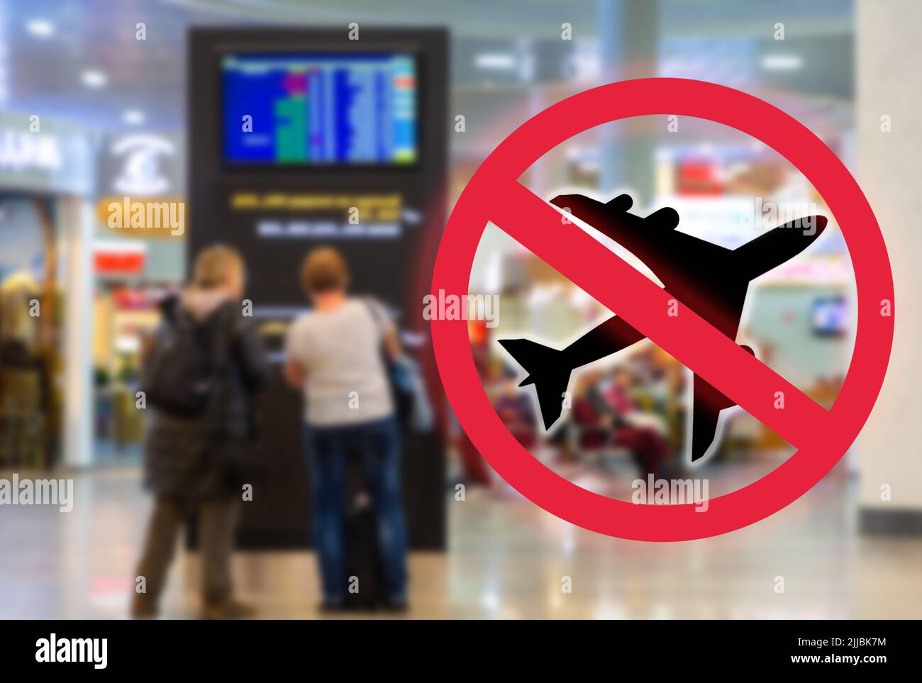 Women stand at the information Board at the airport. Blurred. A red ...