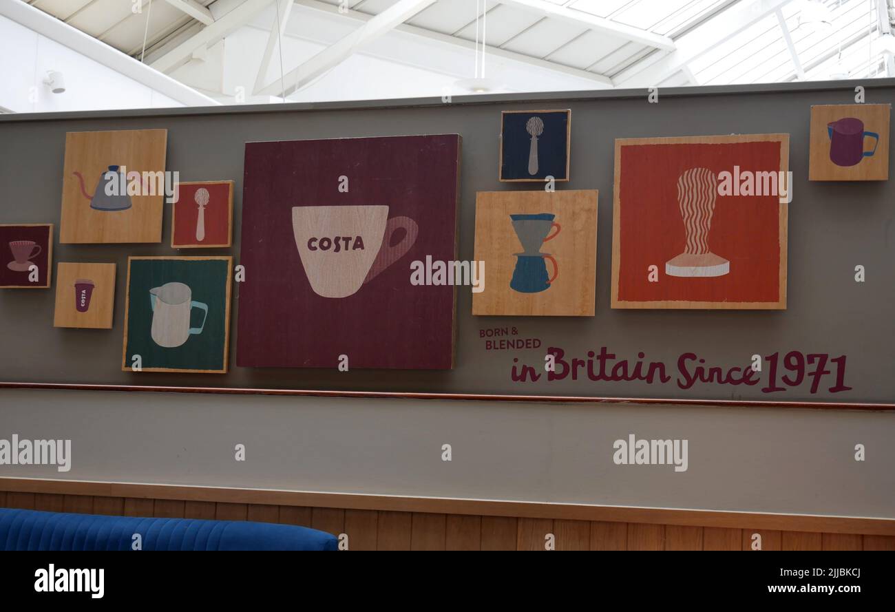 Picture story boards of various sizes and colours mounted on a room ...