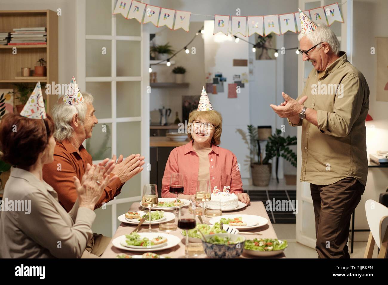 Woman clapping indoor party hi-res stock photography and images - Alamy