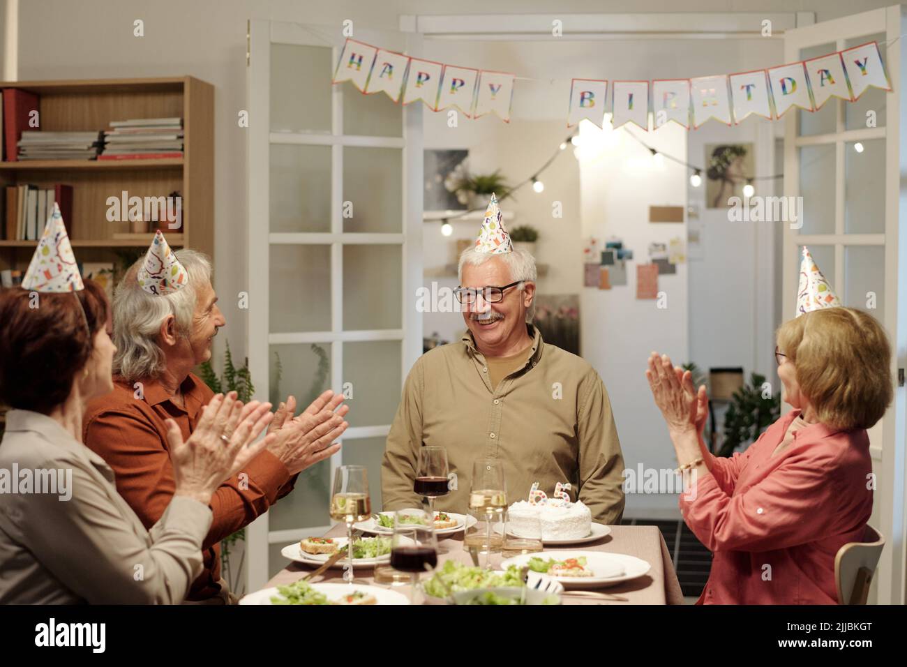 Woman clapping indoor party hi-res stock photography and images - Alamy
