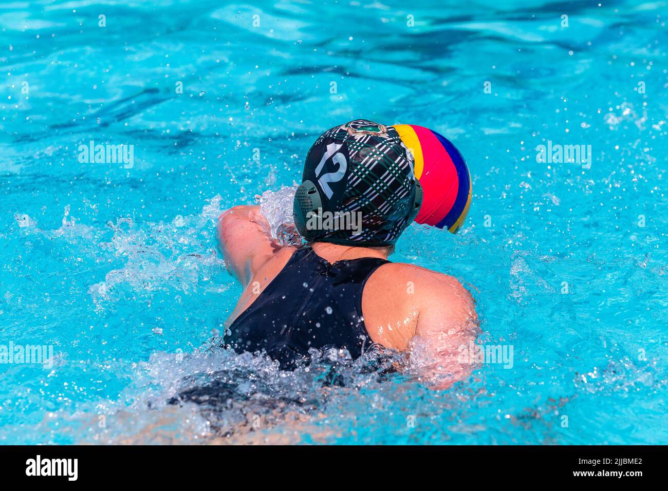 Waterpolo Game Swimmer Girl Female Player Unrecognizable Behind Rear Photo With Ball In Hand