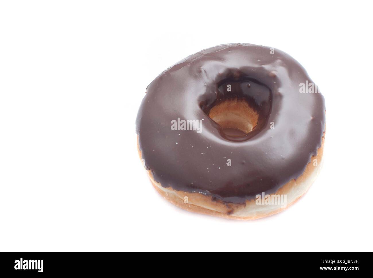 High angle view of a delicious chocolate frosted ring doughnut on a ...