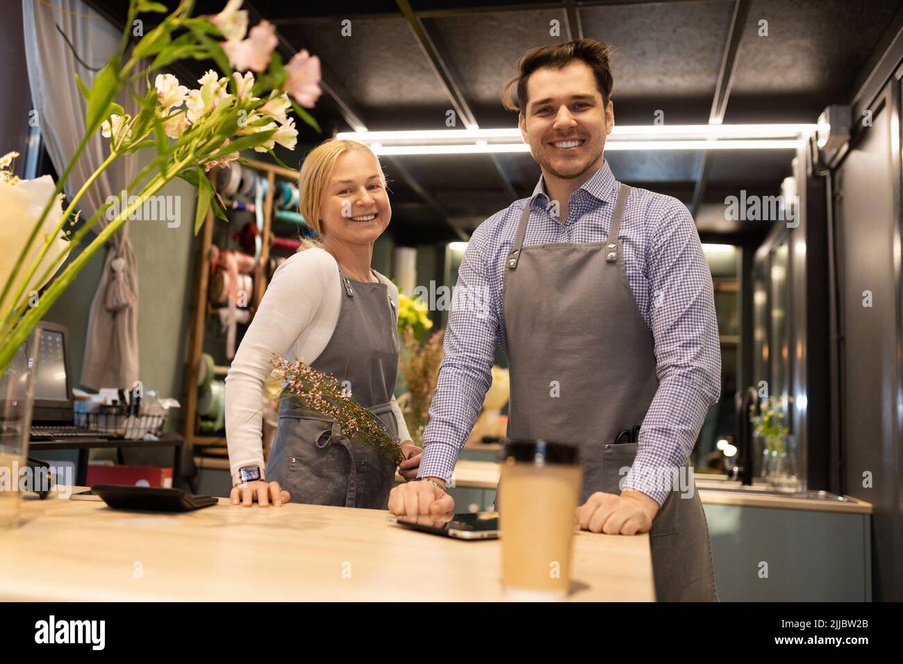 Caucasian florist selling bouquets hi-res stock photography and images ...