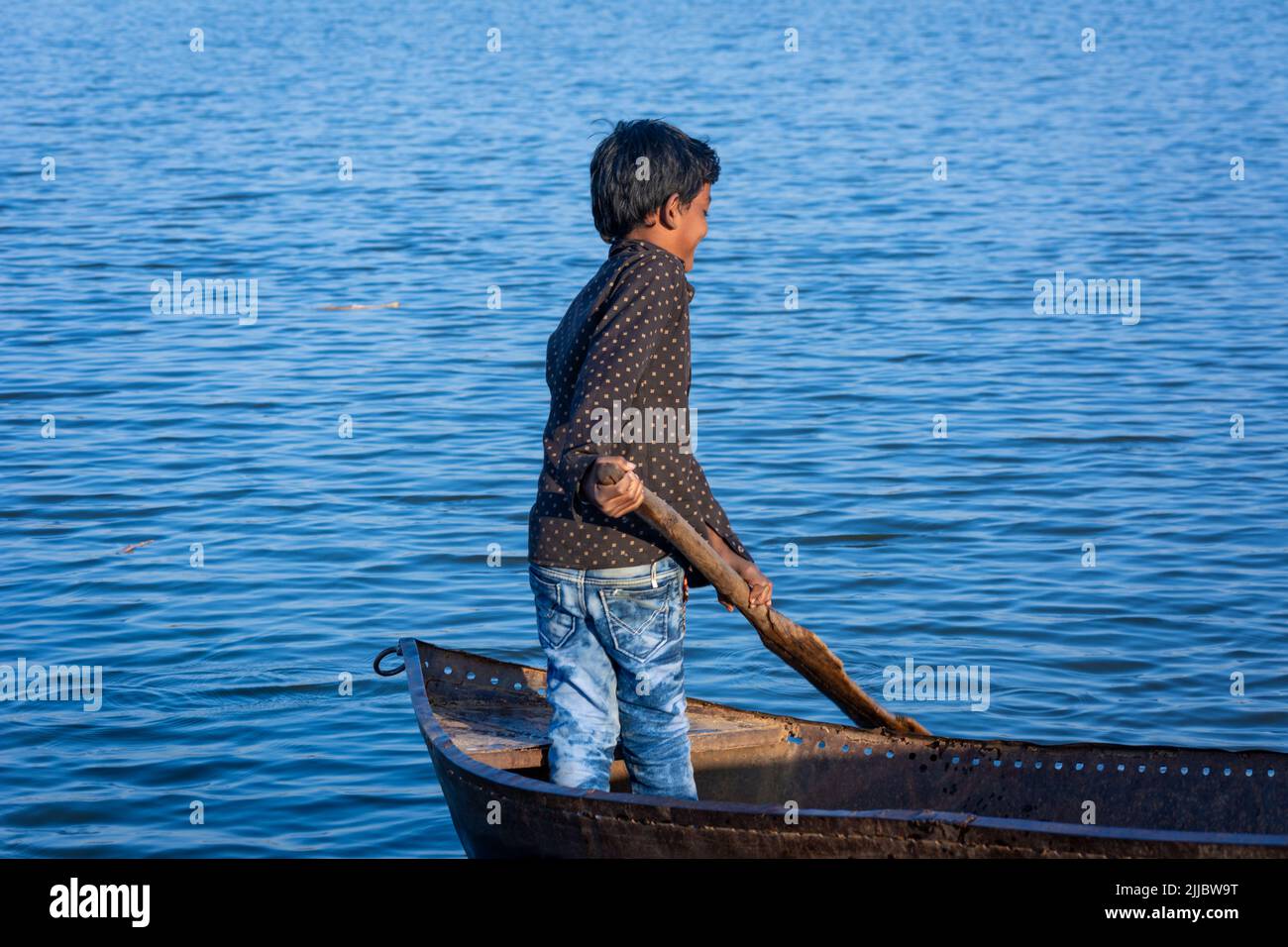 India teen boy boat hi-res stock photography and images - Alamy