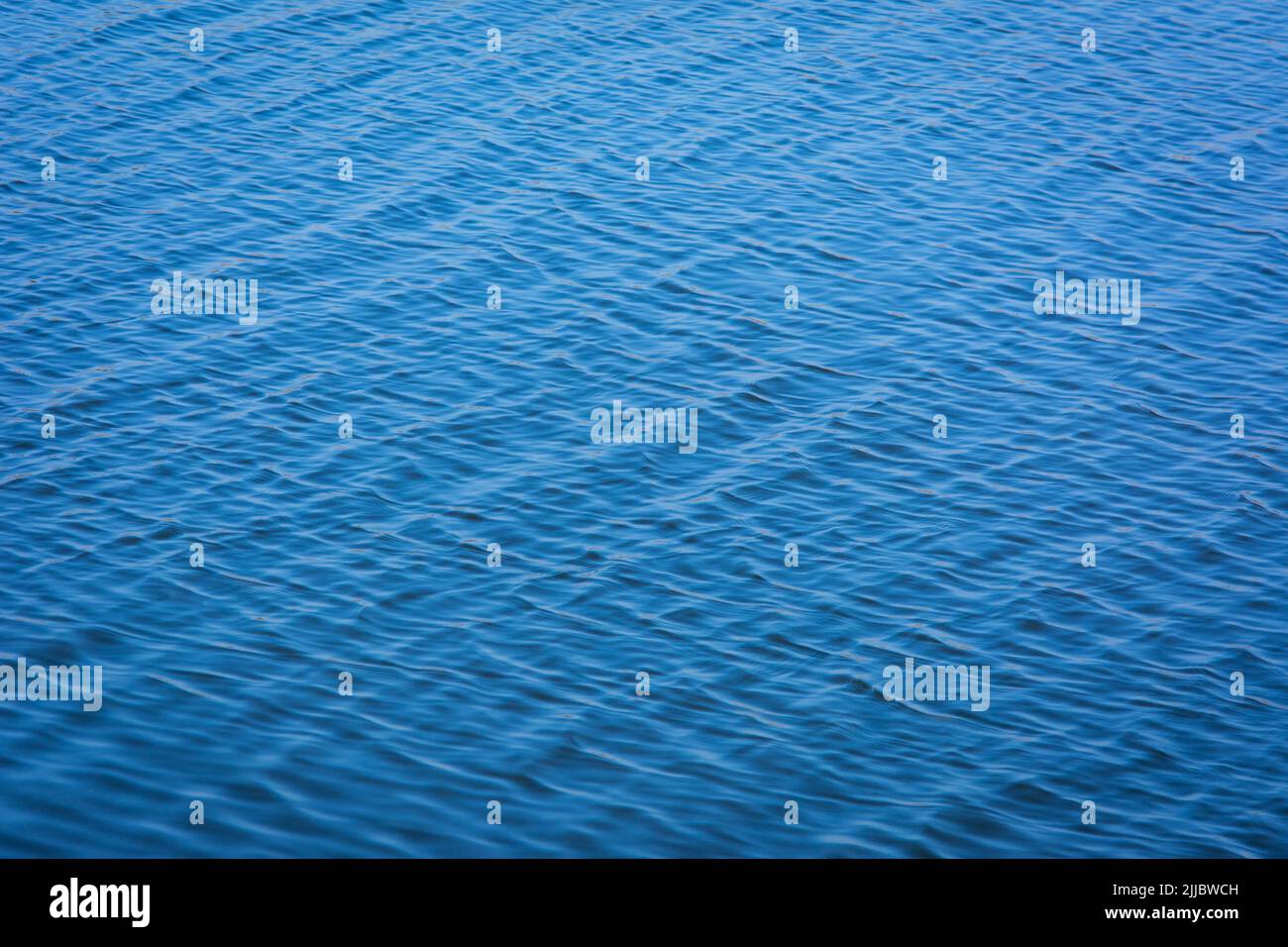 Blue tones water waves surface as background Stock Photo - Alamy