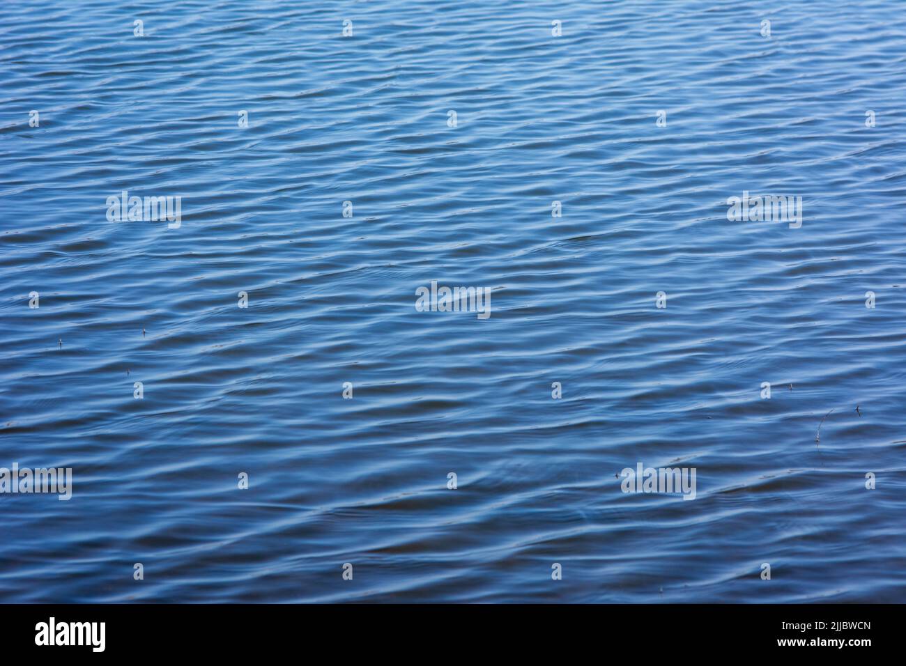 Blue tones water waves surface as background Stock Photo - Alamy