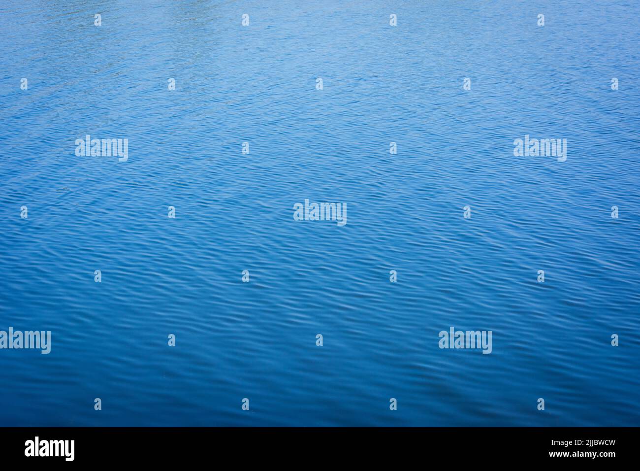 Blue tones water waves surface as background Stock Photo - Alamy