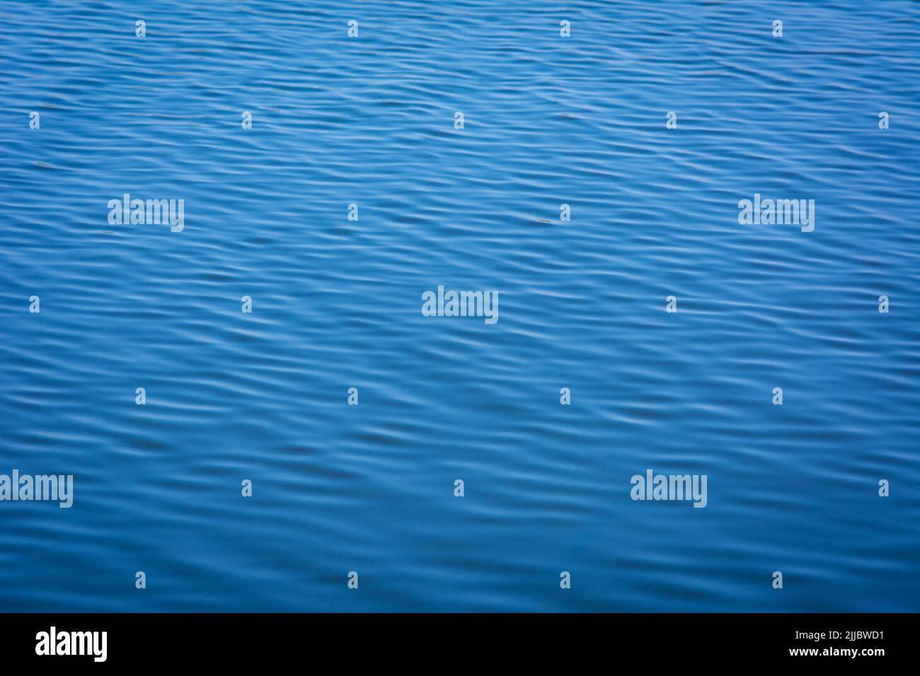 Blue tones water waves surface as background Stock Photo - Alamy
