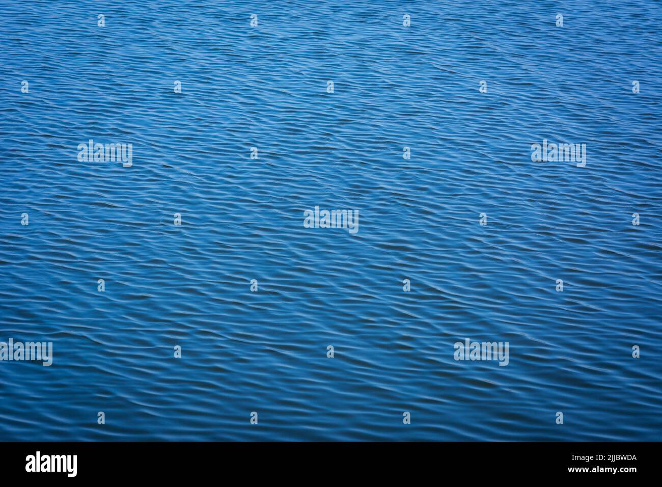Blue tones water waves surface as background Stock Photo - Alamy