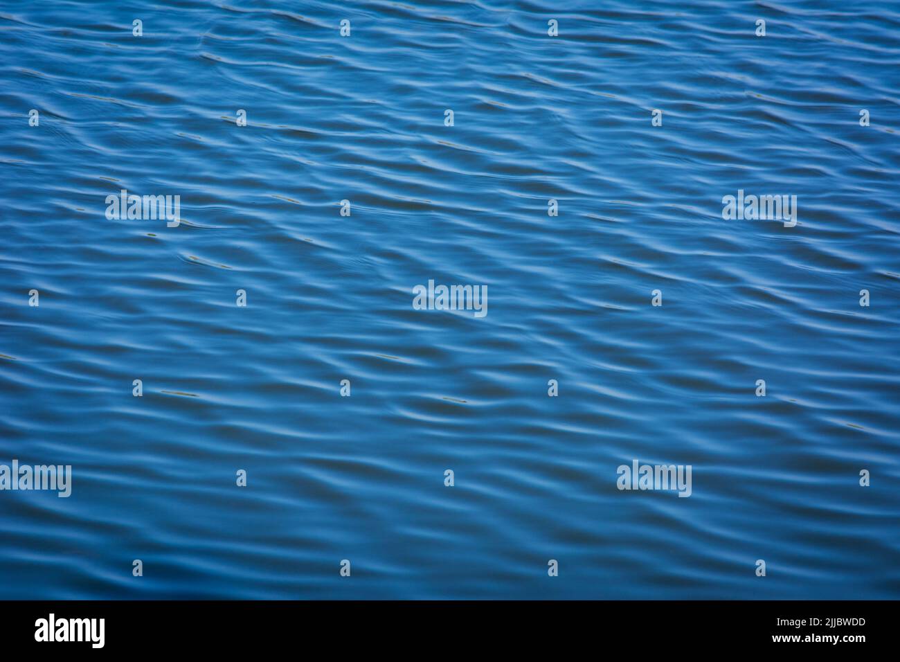 Blue tones water waves surface as background Stock Photo - Alamy