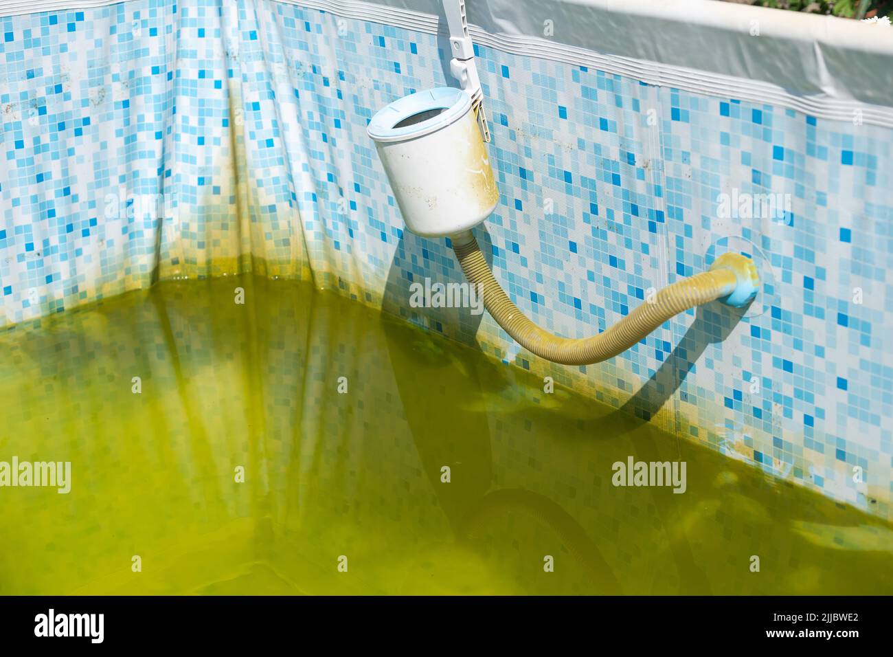 cleaner and filter very dirty swimming pool in the garden Stock Photo ...